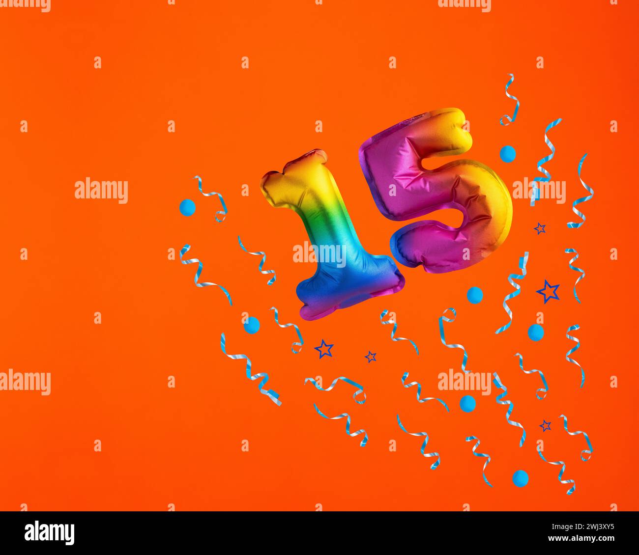 Confetti explosion with number 15 balloon - Celebration on orange ...