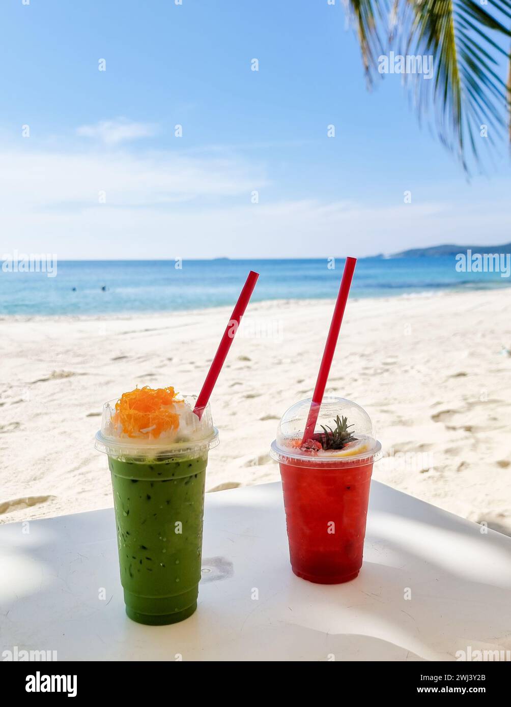 Cold green tea and strawberry shake tropical drinks on the beach of Koh ...