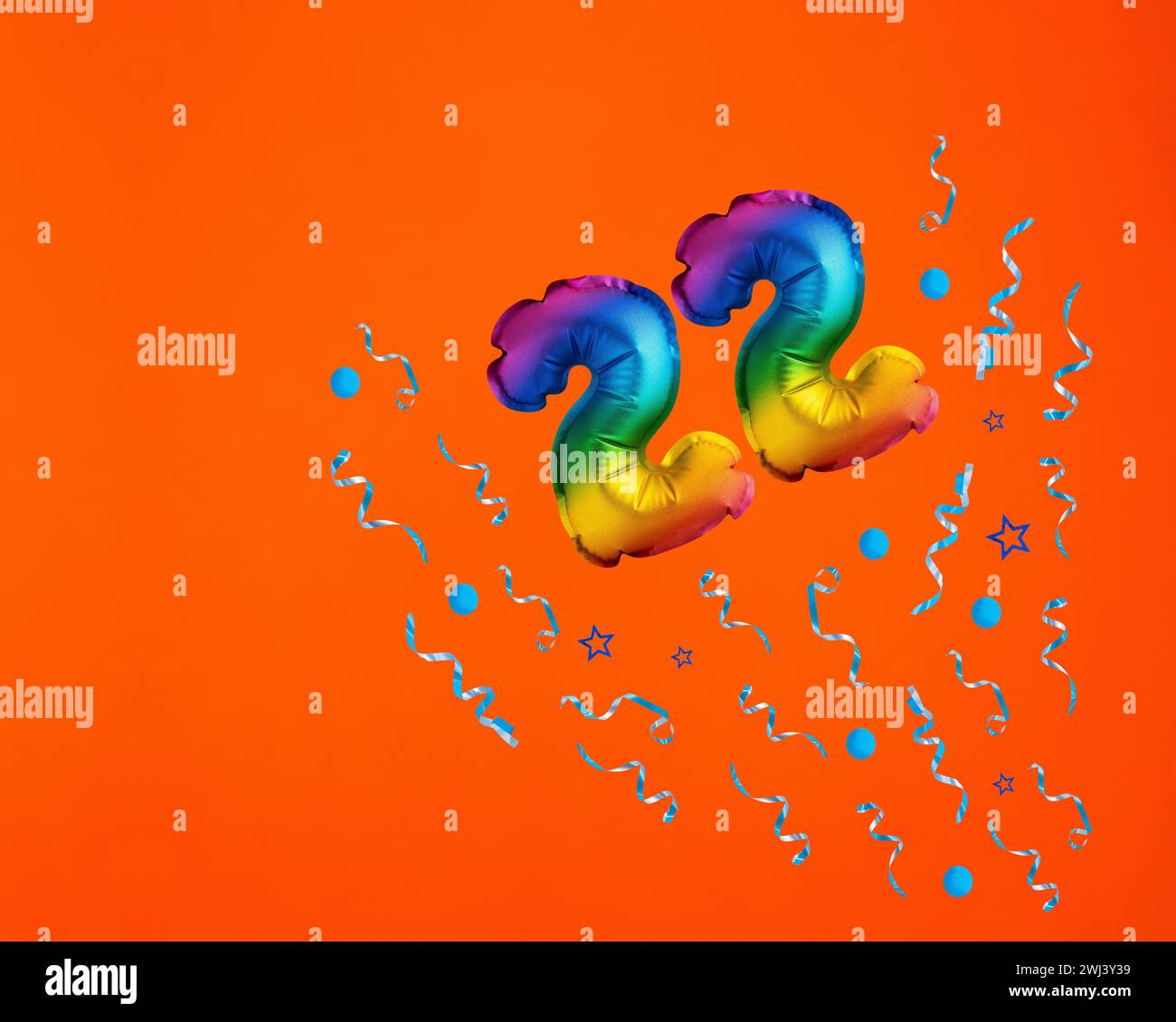 Multicolor balloon number 22 - Confetti explosion on orange background ...