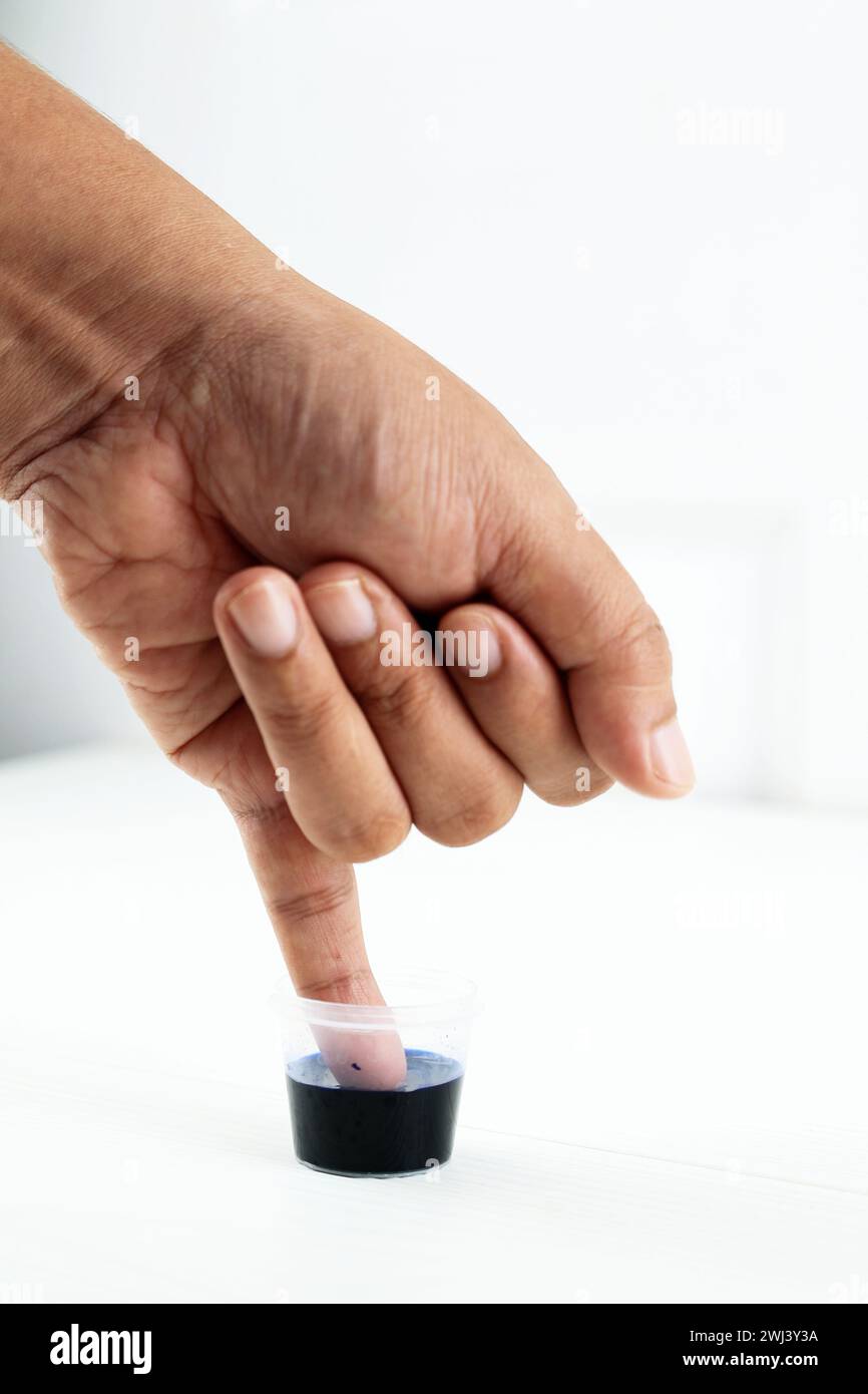 A Man's Little Finger Dipped Ink After Voting in the Indonesian ...