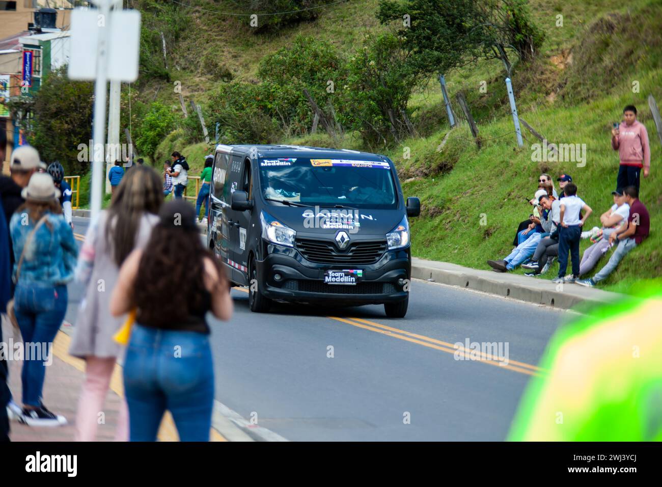 LA CALERA, COLOMBIA - FEBRUARY 11, 2024: Team accompanying vehicle ...