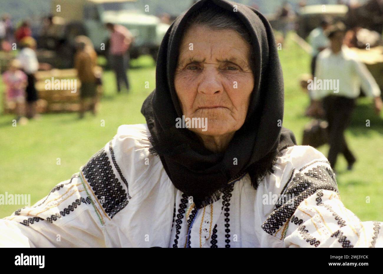 Portrait of elderly woman wearing traditional handmade clothing at a ...