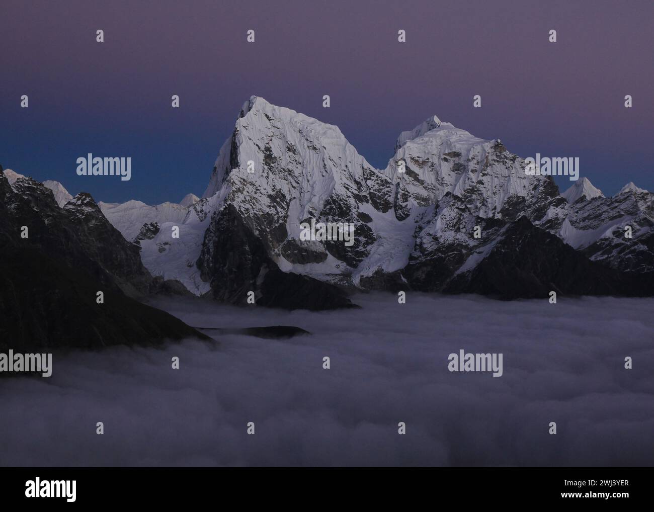 Purple sky over Mount Cholatse and Tobuche, Nepal Stock Photo - Alamy