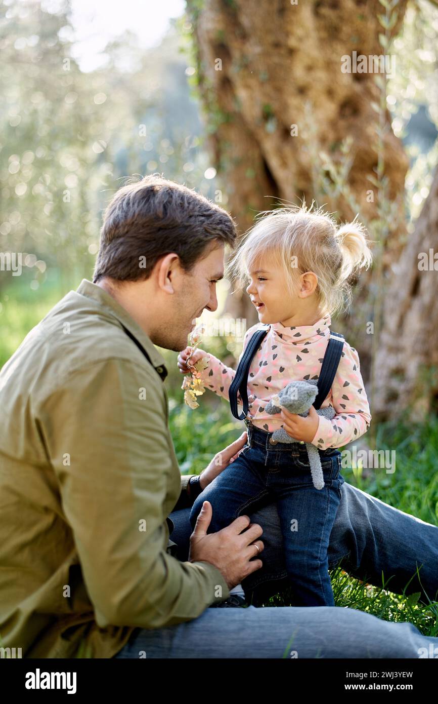 Girl sitting on lap hi-res stock photography and images - Alamy