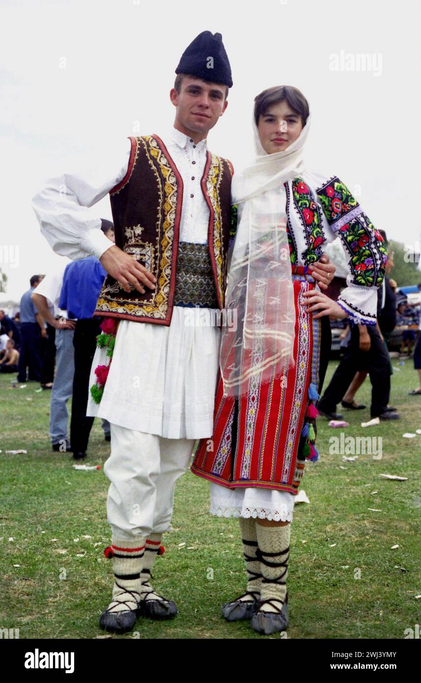 Young couple wearing traditional handmade clothing at a country fair in ...