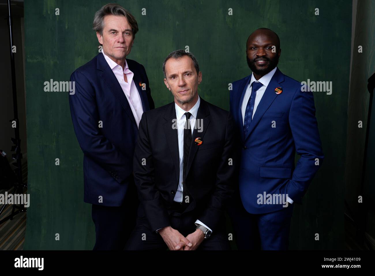 Christopher Sharp, from left, John Battsek, and Moses Bwayo pose for a ...