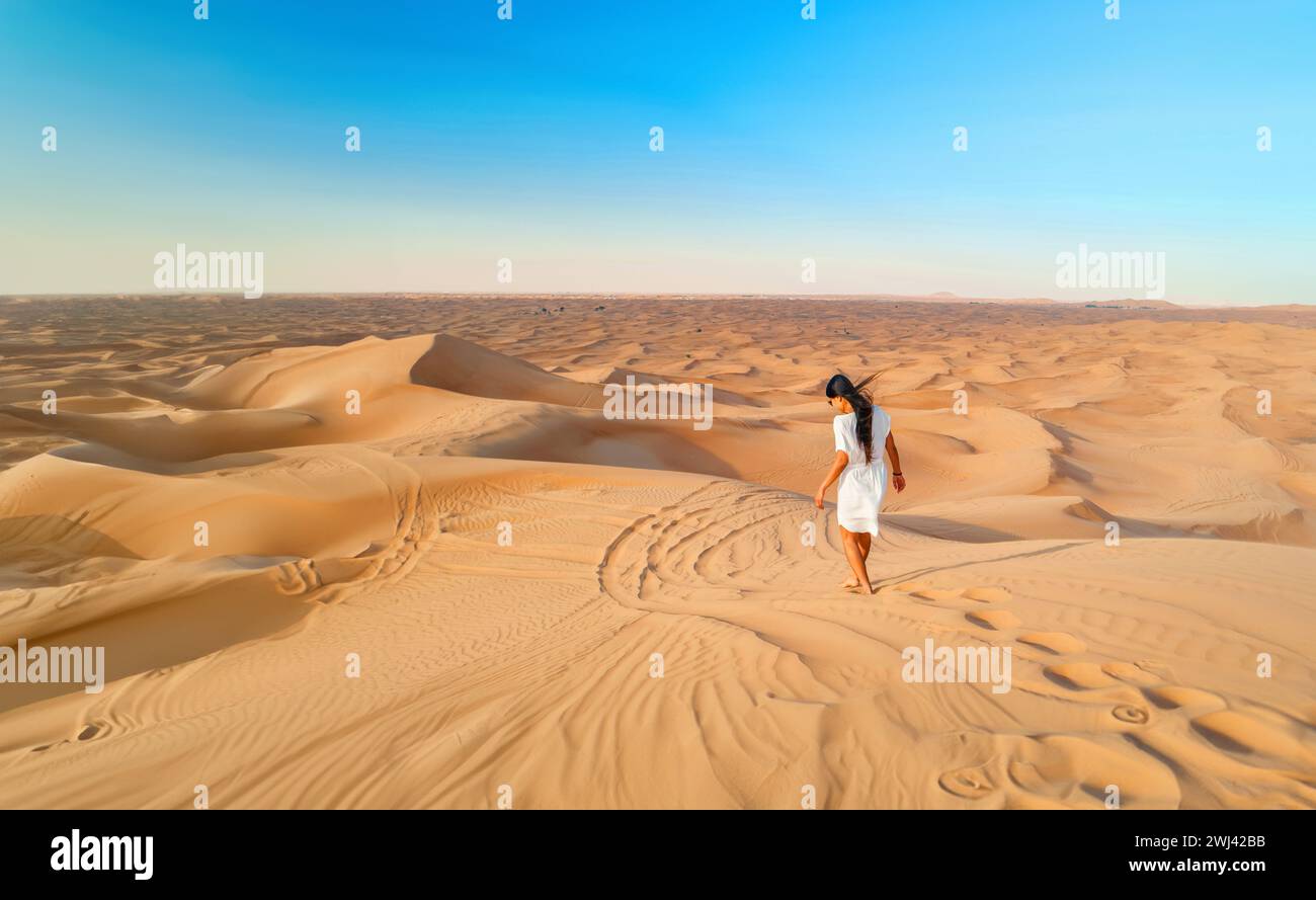 Dubai dessert sand dunes, couple on Dubai desert safari,United Arab ...