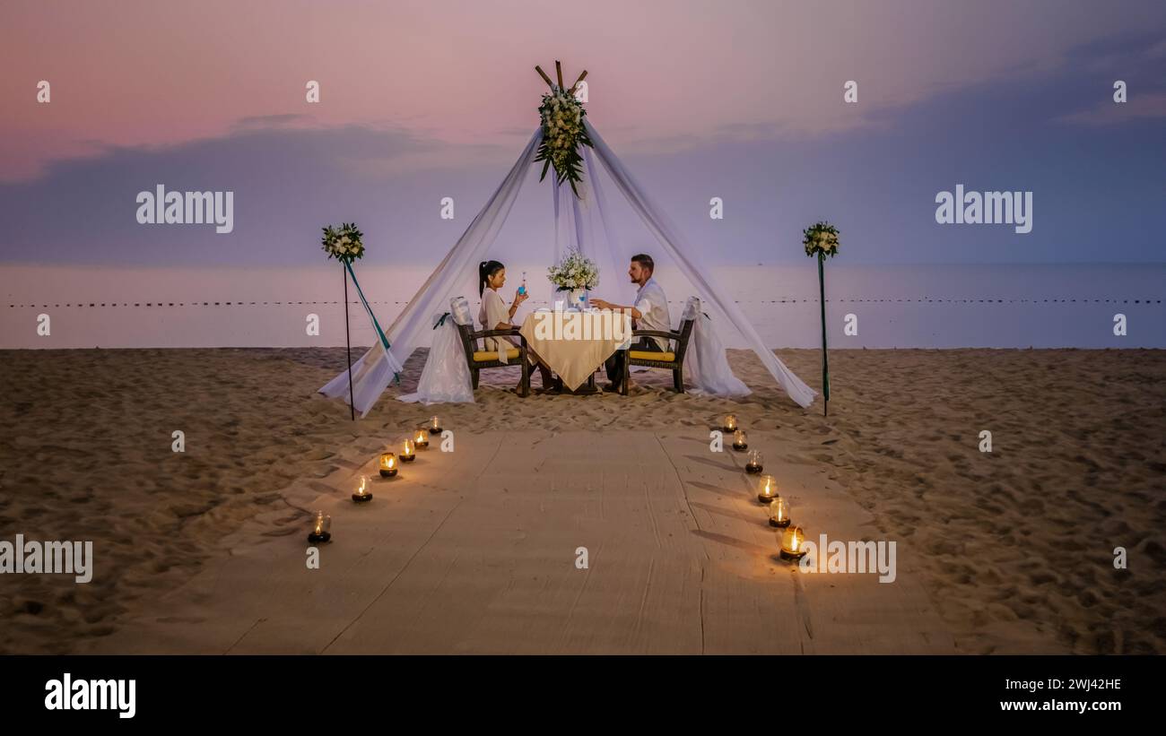 Romantic candlelight dinner on beach hi-res stock photography and ...