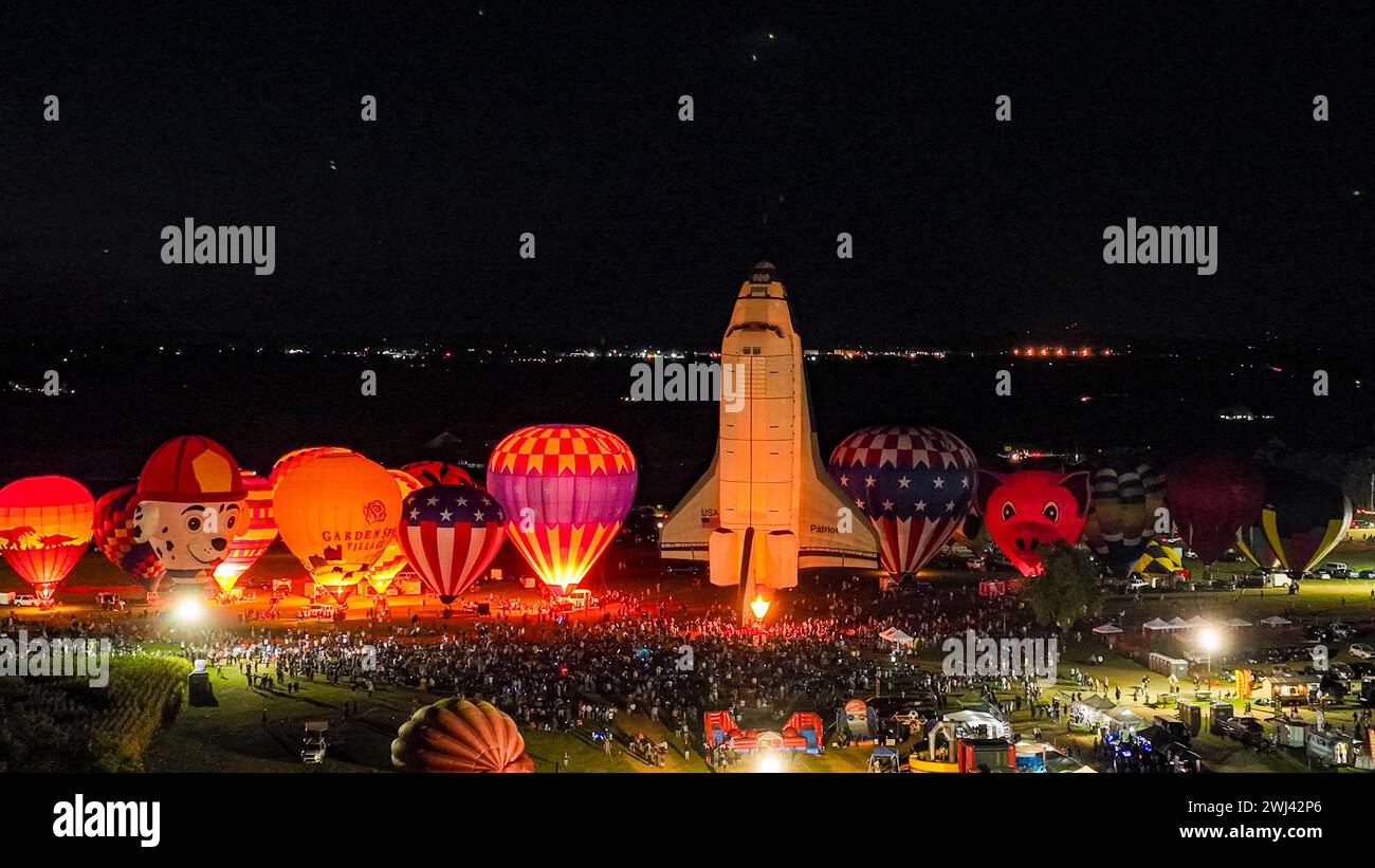Aerial View of Hot Air Balloons Doing a Balloon Glow With a Space ...