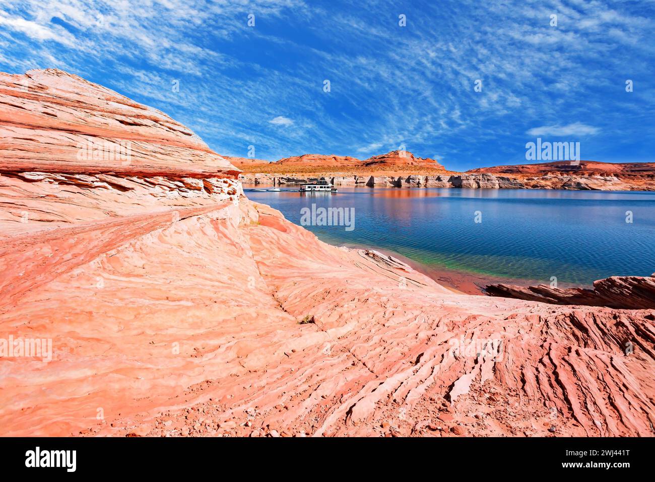 Lake Powell. The smooth emerald water of the lake contrasts with the ...