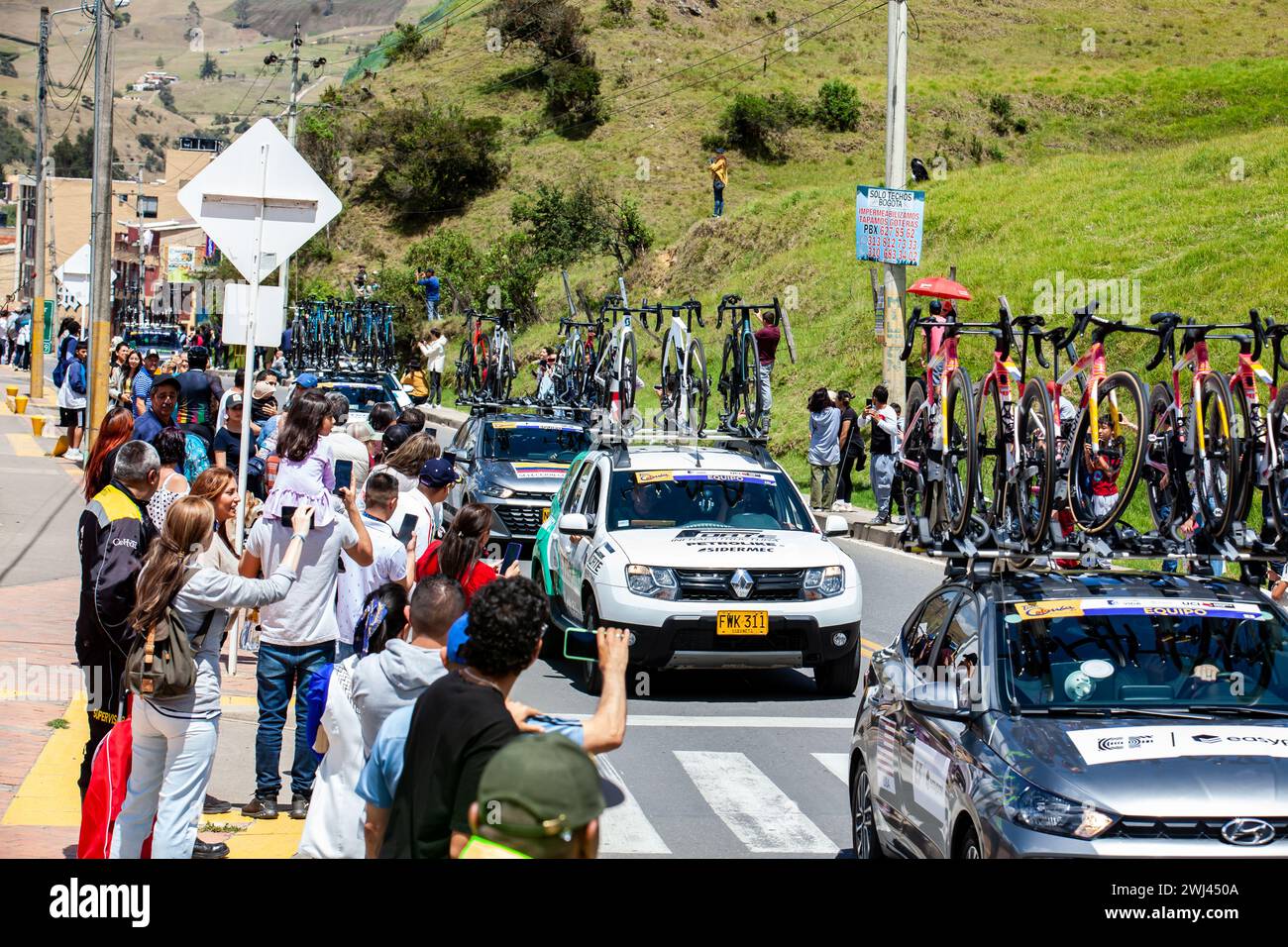 LA CALERA, COLOMBIA - FEBRUARY 11, 2024: Team accompanying vehicles ...