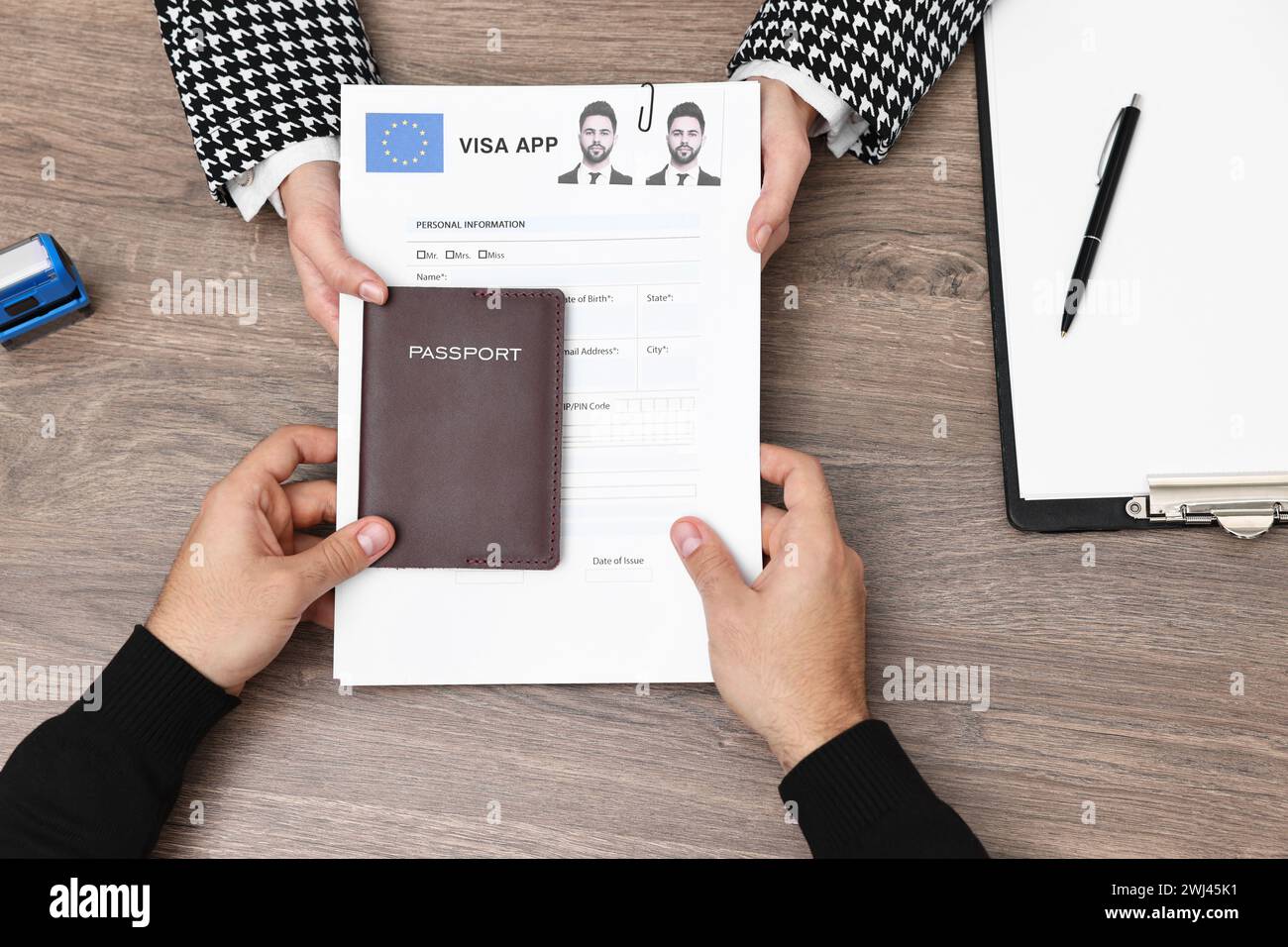 Immigration to European Union. Embassy worker giving visa application ...