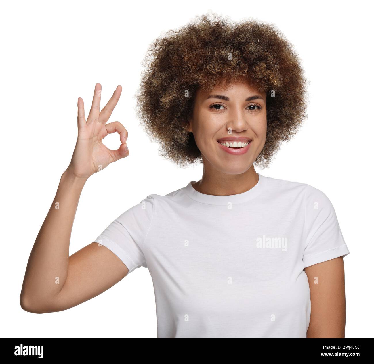 Woman with clean teeth showing OK gesture on white background Stock ...