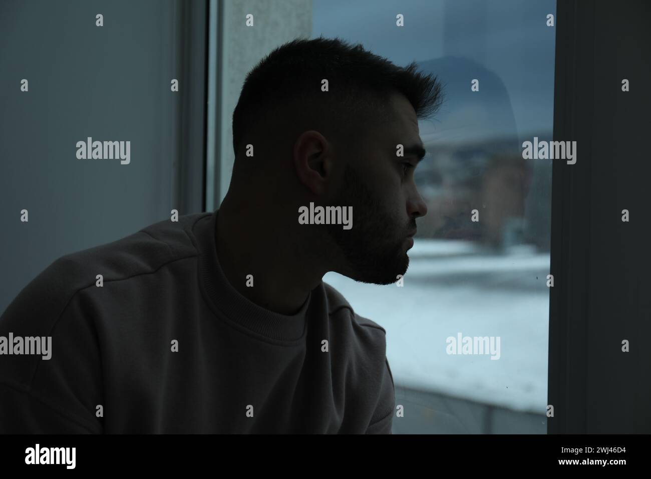 Sad man in dark room hi-res stock photography and images - Alamy