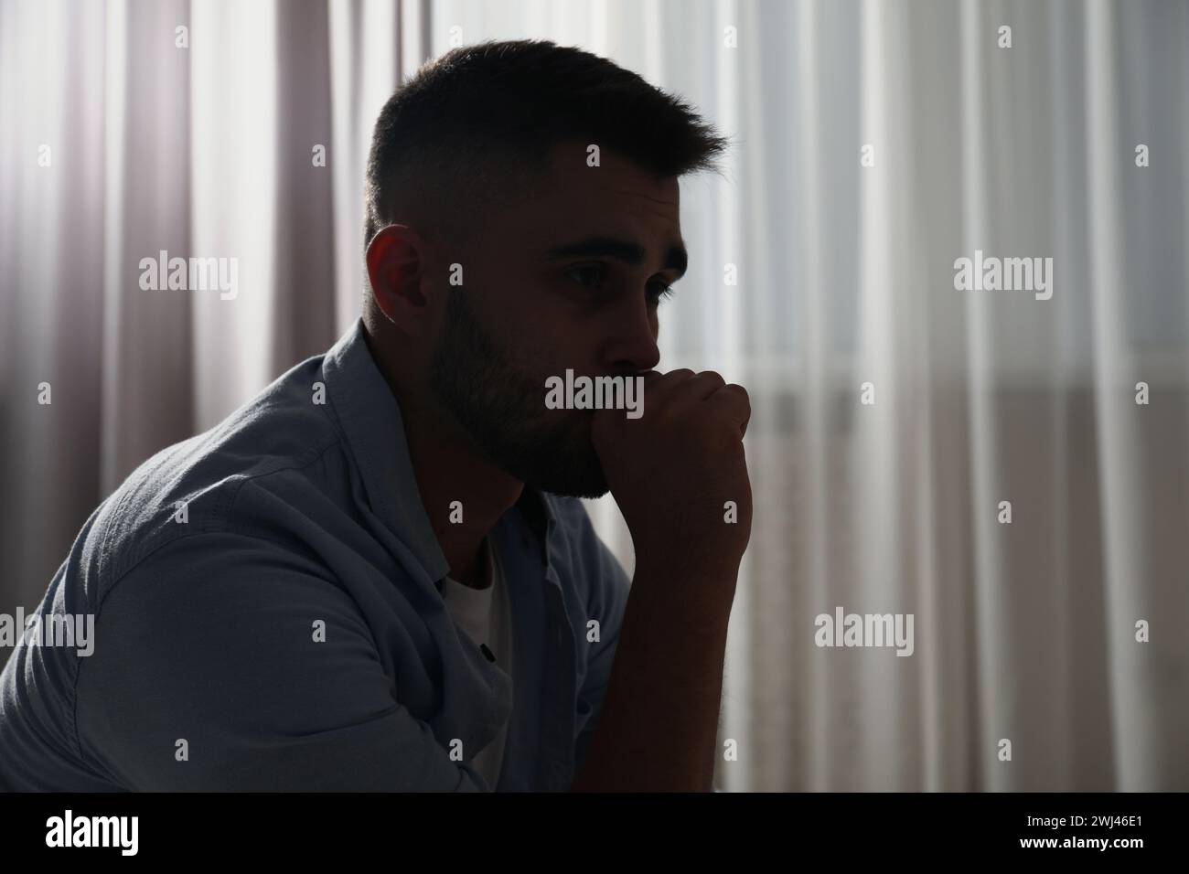 Adult silhouette sad window hi-res stock photography and images - Alamy