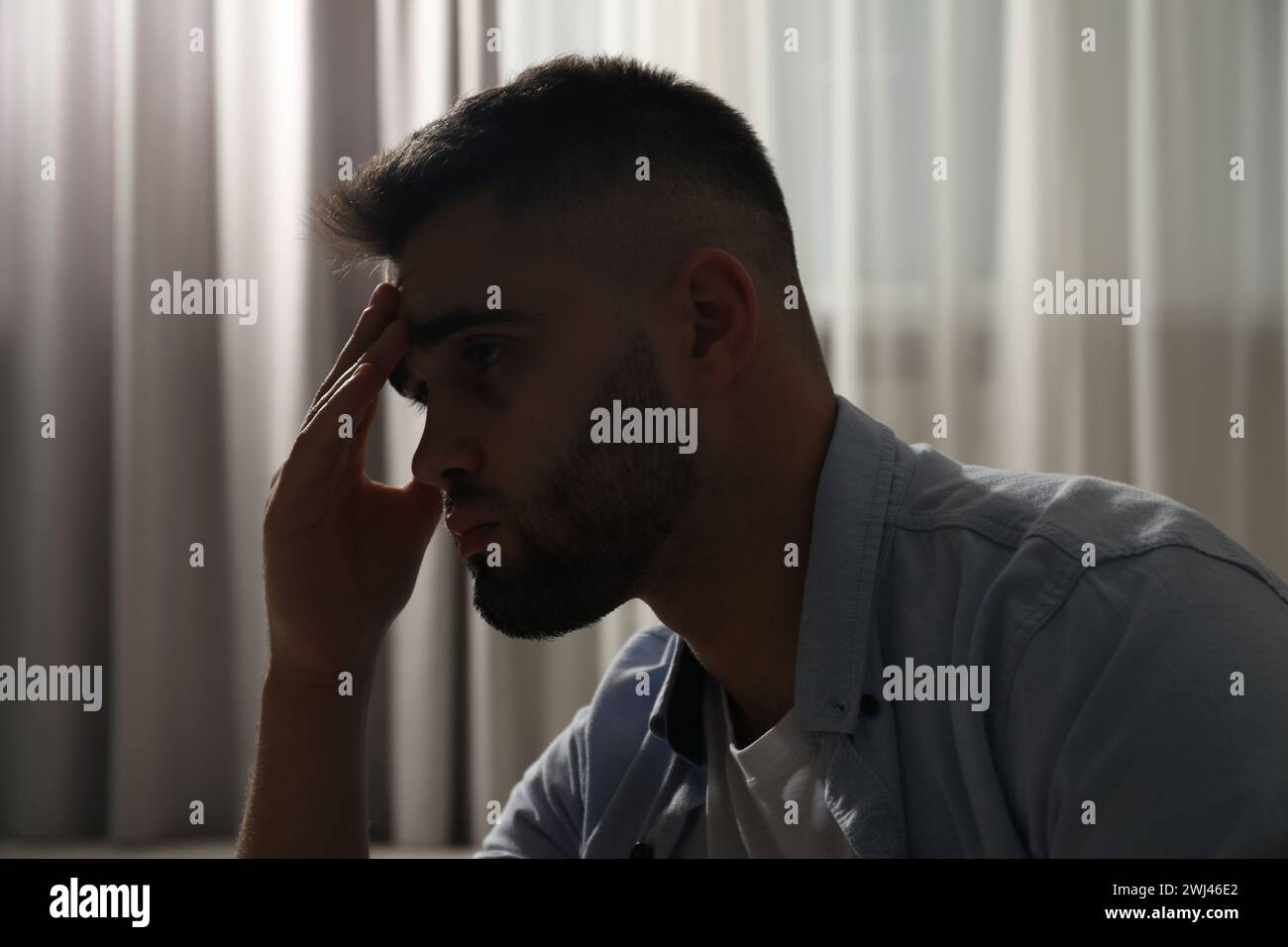 Sad man on blurred hi-res stock photography and images - Alamy