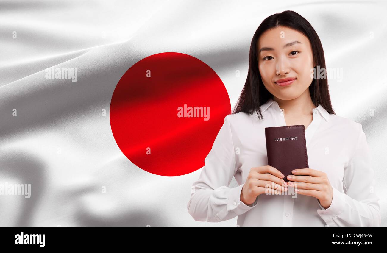 Immigration. Woman with passport against national flag of Japan, space ...