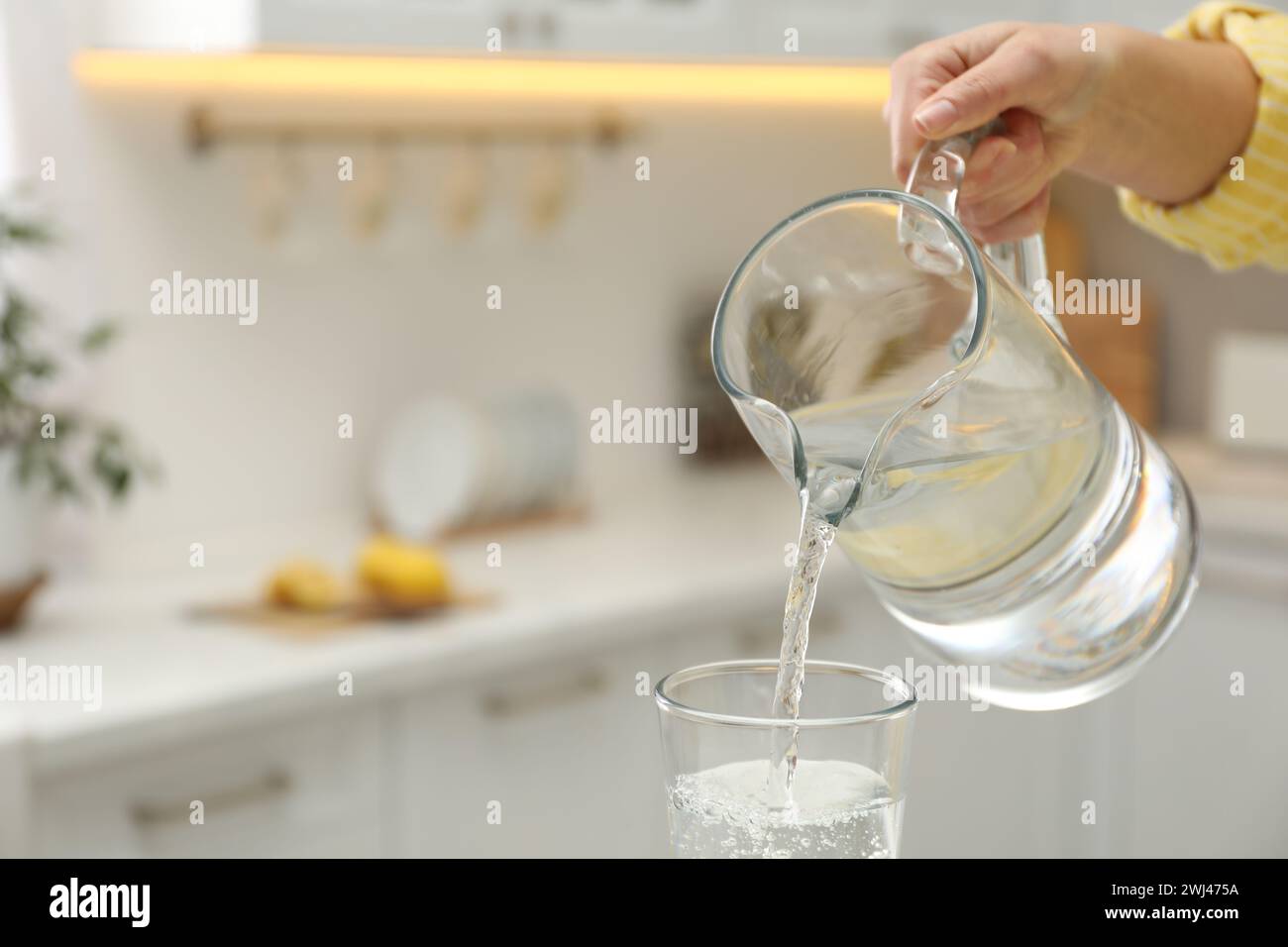 Pouring water from jug hi-res stock photography and images - Alamy