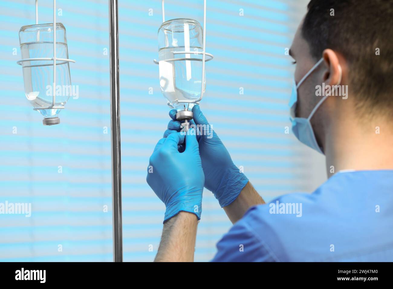 Nurse setting up IV drip in hospital, selective focus Stock Photo - Alamy