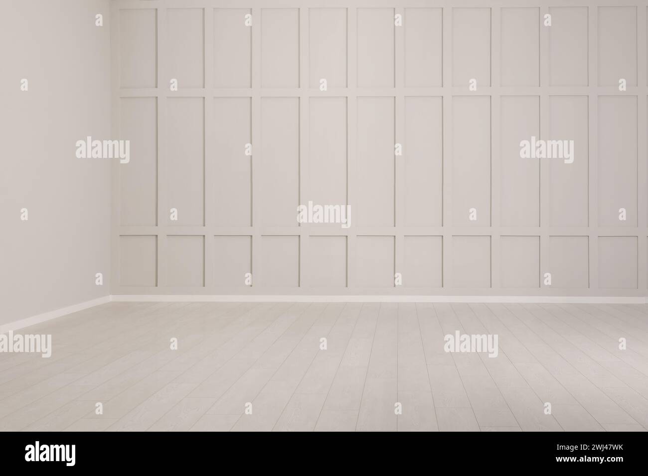 Empty room with beige walls and laminated flooring Stock Photo - Alamy