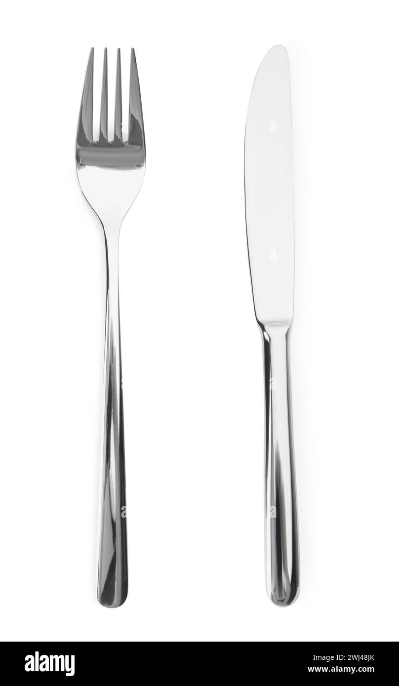 Silver fork and knife isolated on white, top view Stock Photo - Alamy