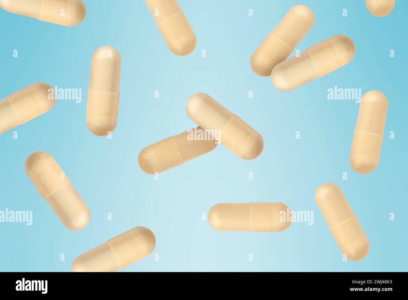 Vitamin. Capsules falling on light blue gradient background Stock Photo ...