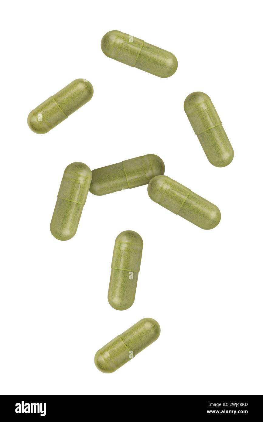 Vitamin. Many capsules falling on white background Stock Photo - Alamy