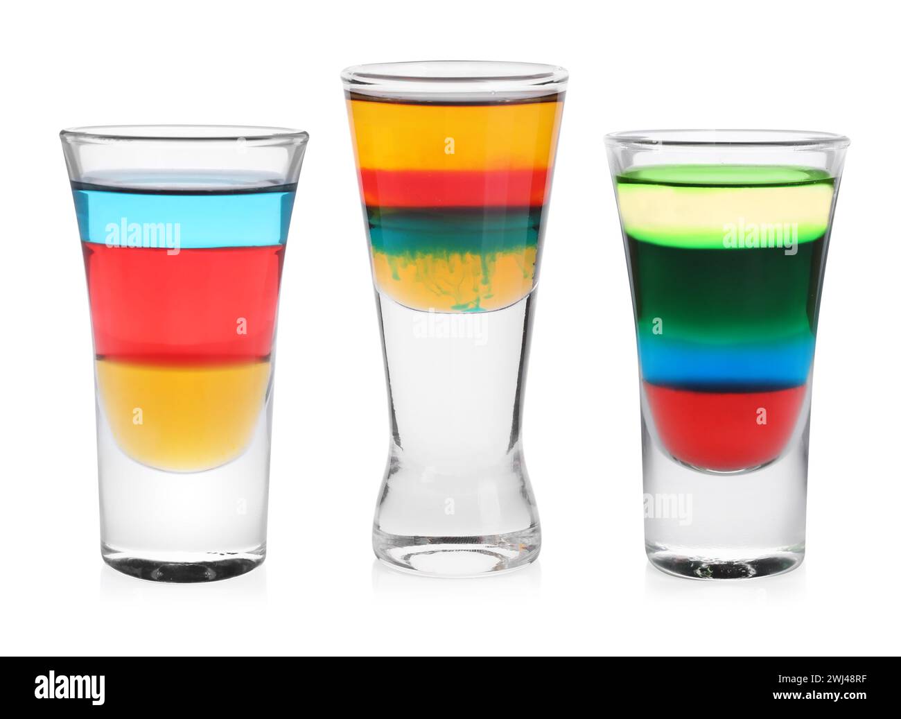 Different shooters in shot glasses isolated on white, set Stock Photo ...