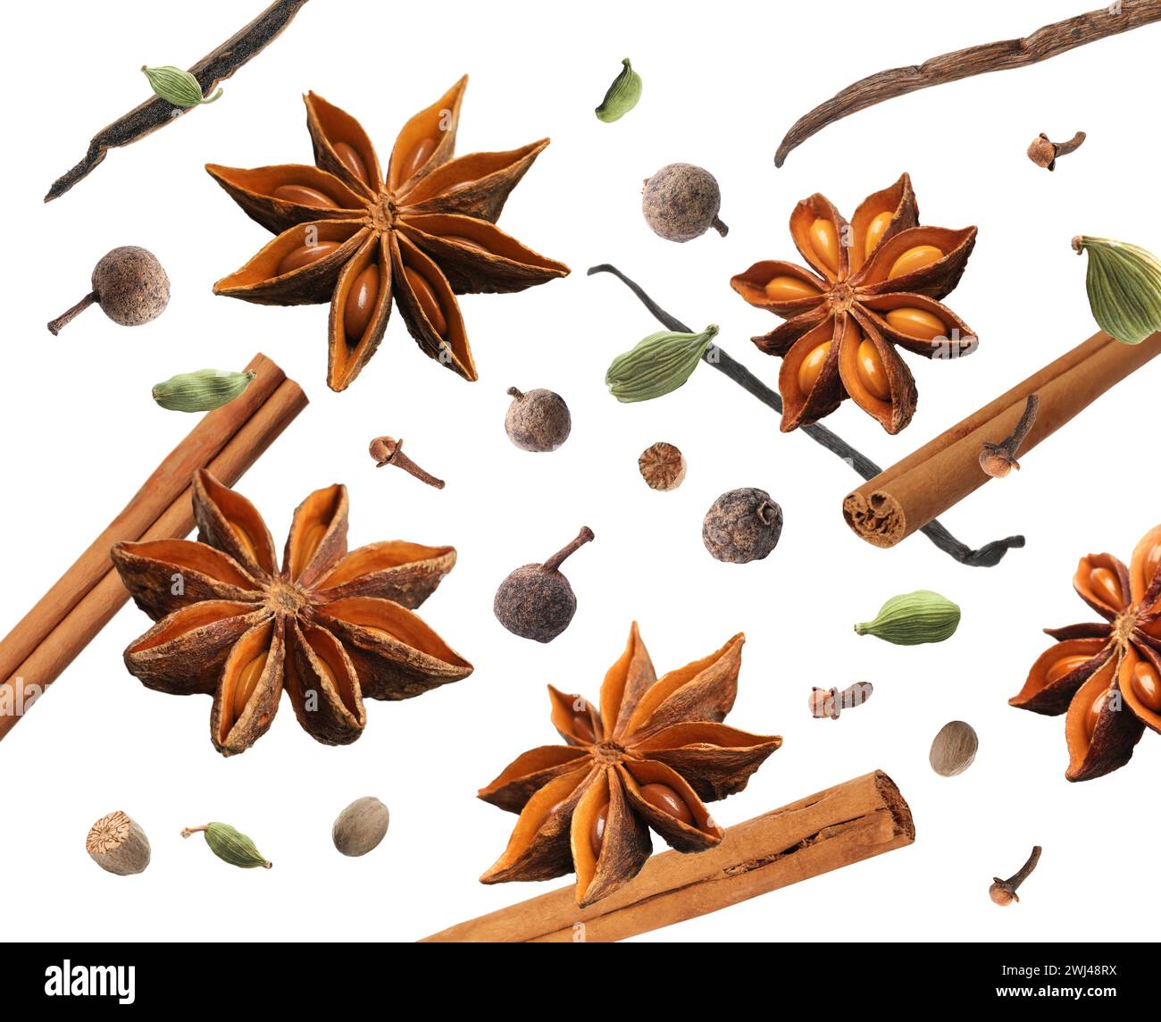Different aromatic spices falling on white background Stock Photo - Alamy