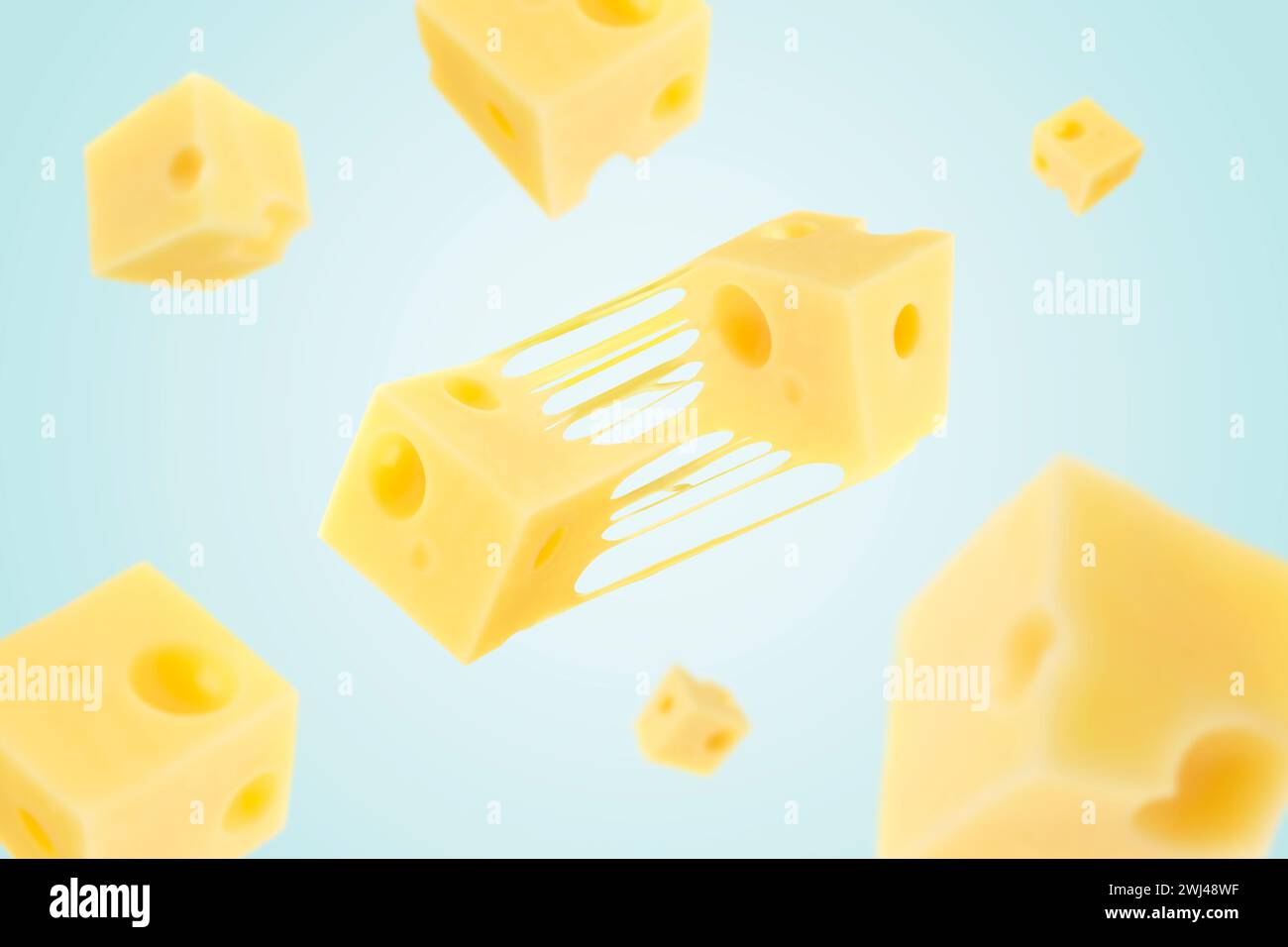 Pieces of cheese falling on light blue background Stock Photo - Alamy