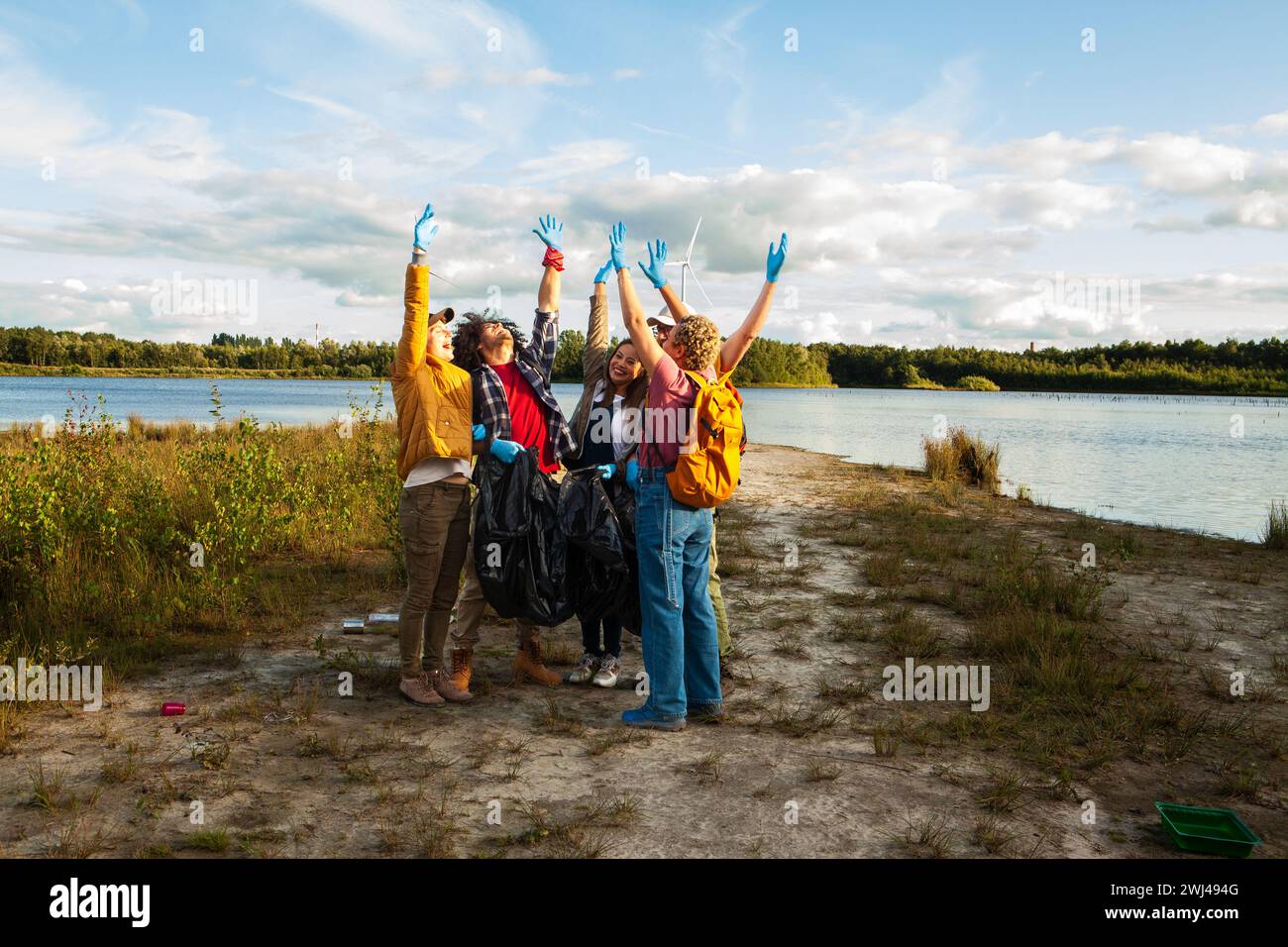 Victory for the Environment: Group Clean-Up Success Stock Photo - Alamy
