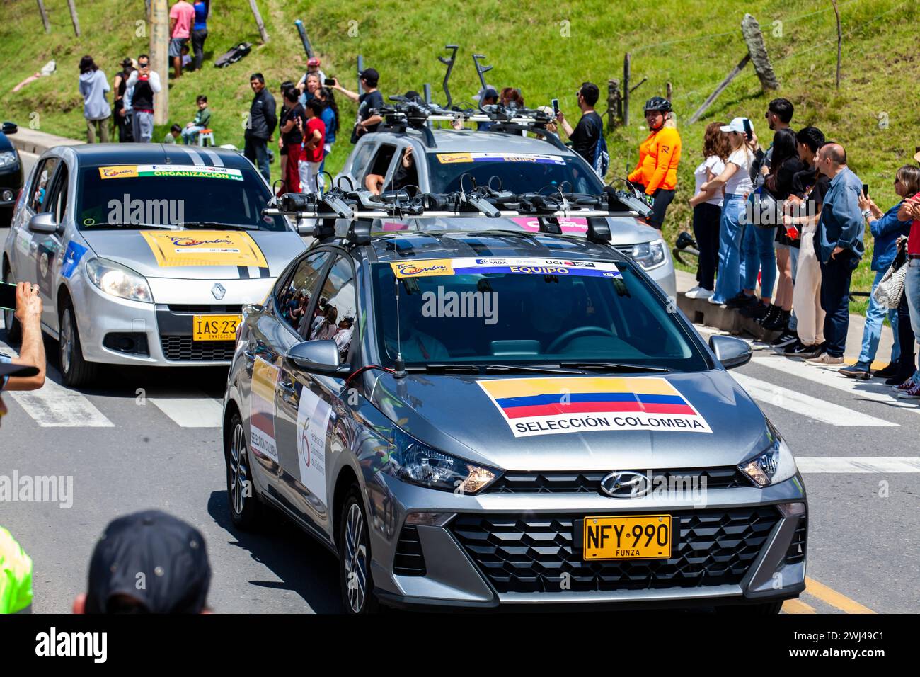 LA CALERA, COLOMBIA - FEBRUARY 11, 2024: Team accompanying vehicle ...
