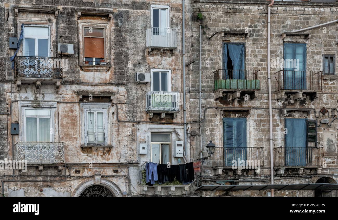 Shabby chic derelict buildings with laundry hanging from the balconies ...