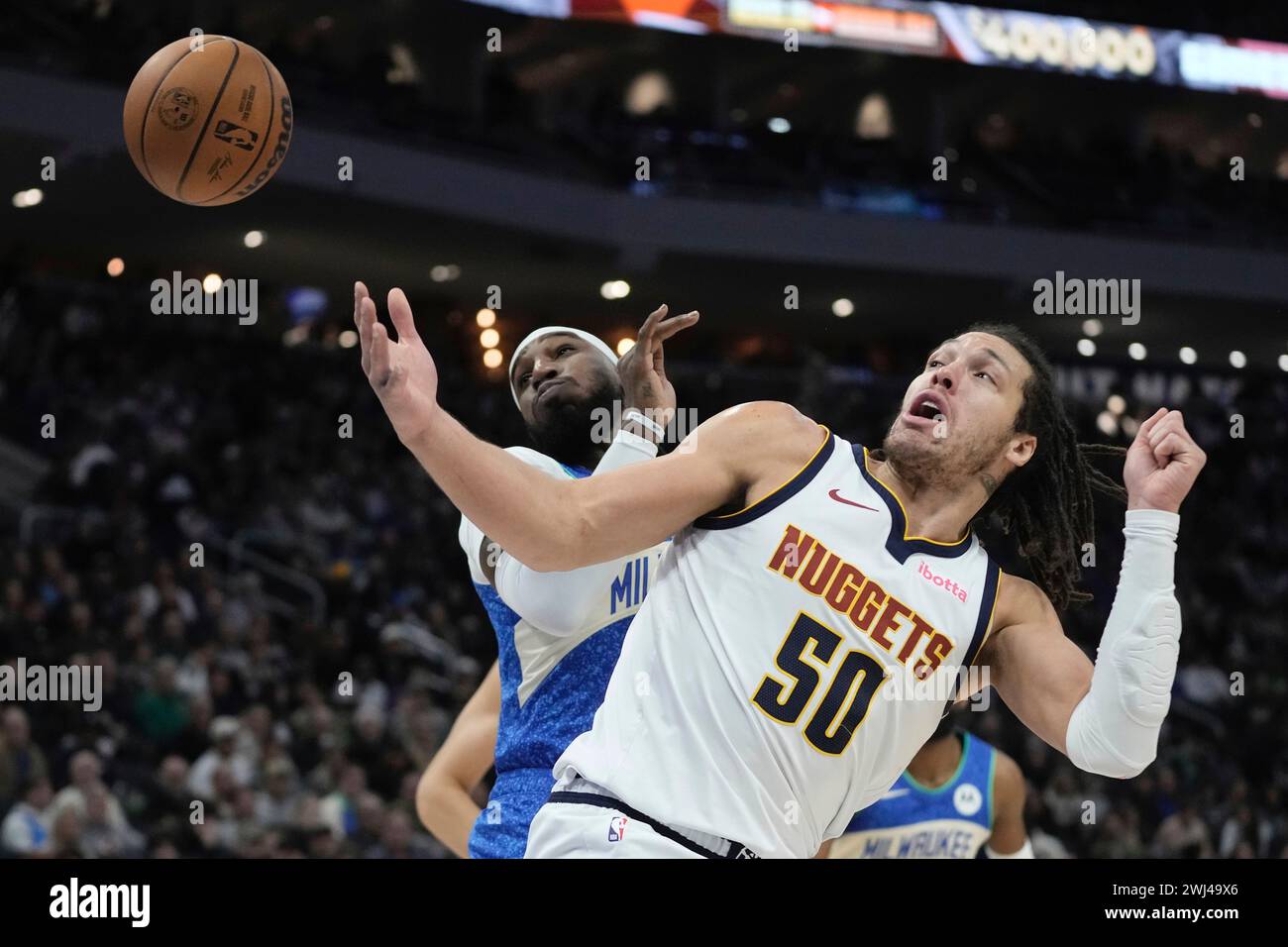 Denver Nuggets' Aaron Gordon and Milwaukee Bucks' Jae Crowder go after ...