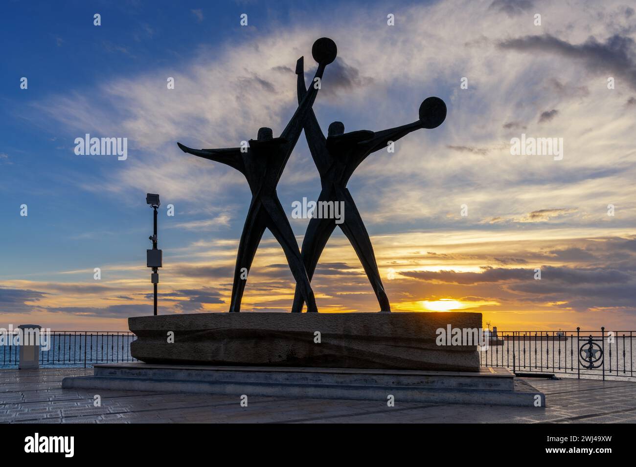 View of the Sailor Monument at the harbor entrance of Taranto at sunset ...