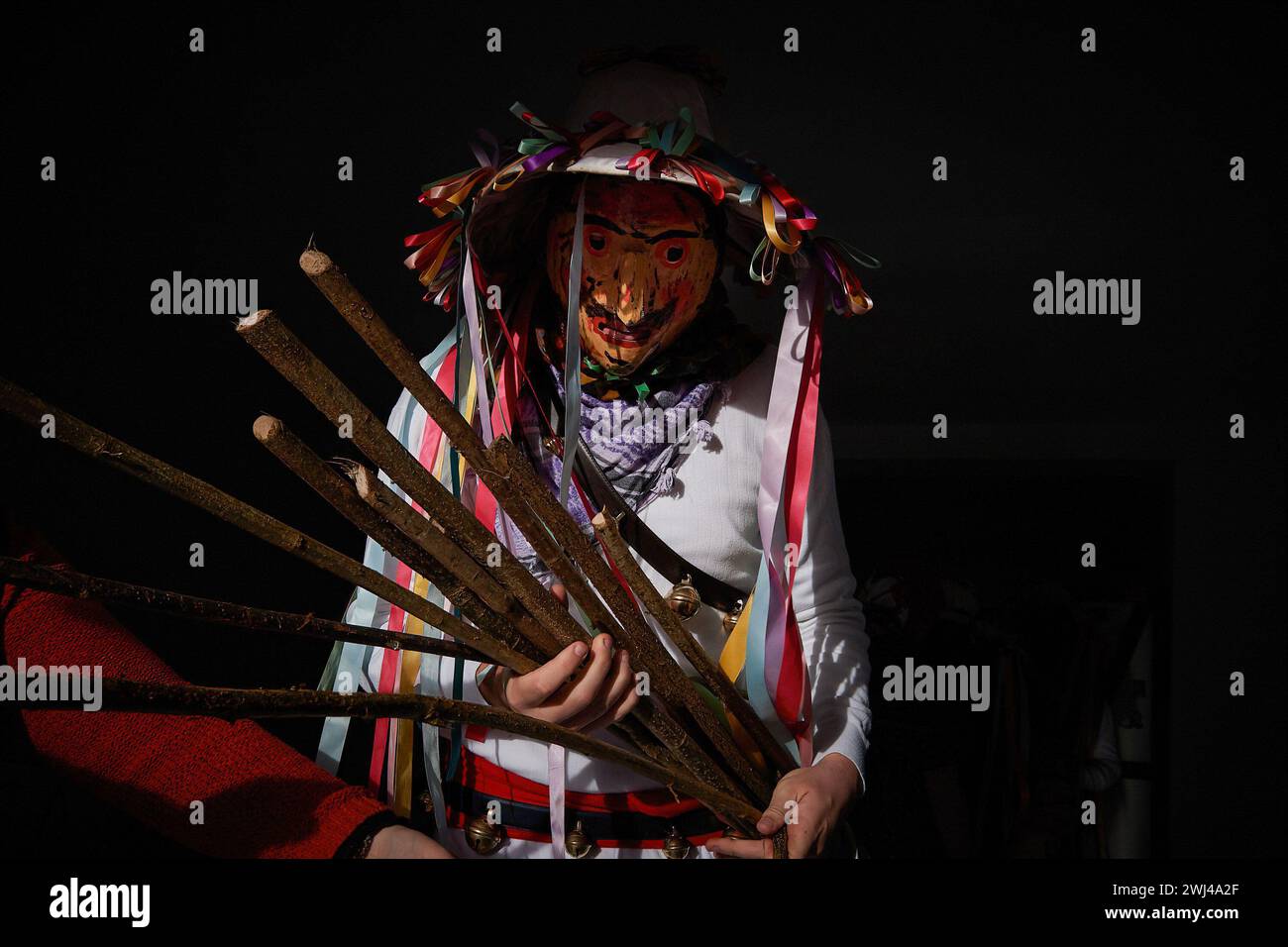 A "mamuxarro" prepares to take the hazelnut sticks to whip those who ...