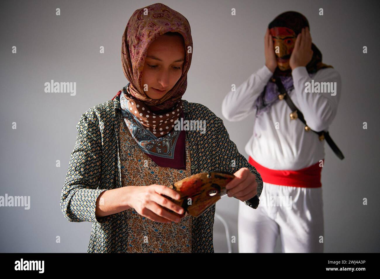 A young "muttu" mute in Basque, prepares to put on the "katola" brass ...
