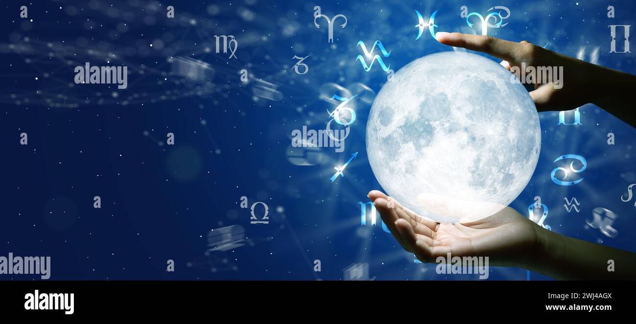 Astrological zodiac signs over the moon in hand. Knowledge of the stars ...