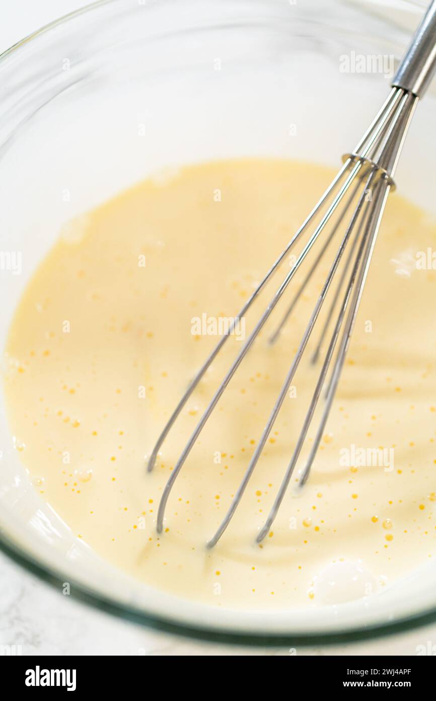 Whisking Delight - Bundt Cake Batter Preparation Begins Stock Photo - Alamy