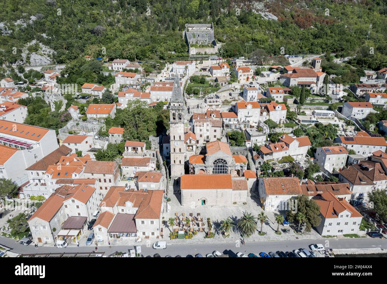Church of St. Nicholas among ancient stone houses. Perast, Montenegro ...