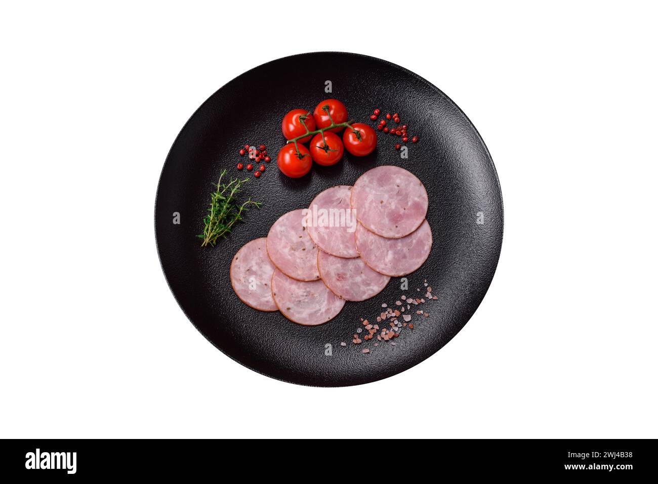 Delicious fresh ham cut into round slices with salt, spices and herbs ...