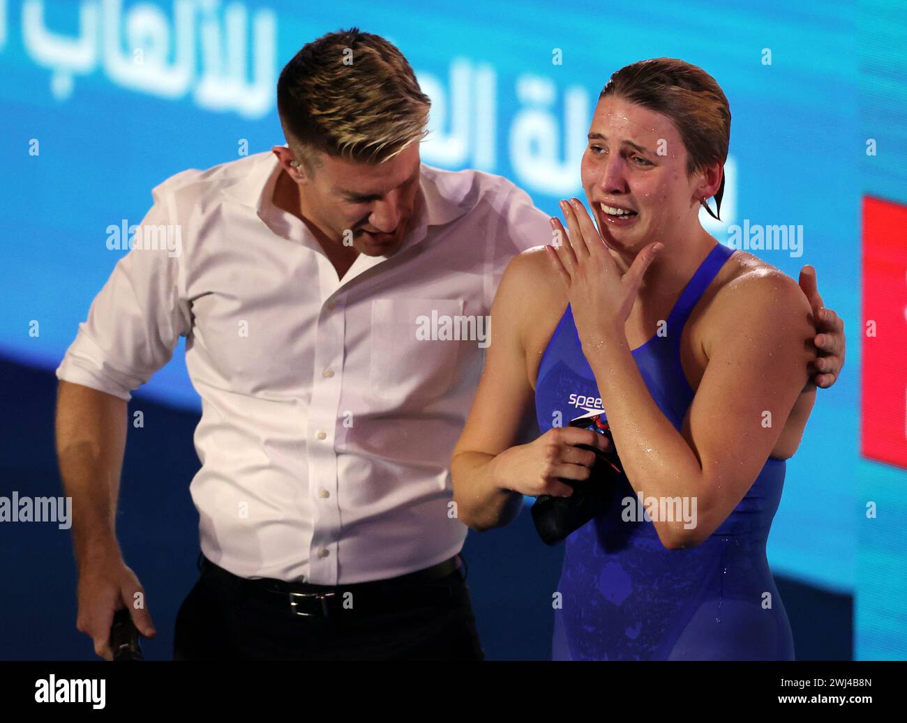 Doha, Qatar. 12th Feb, 2024. Angelina Kohler (R) of Germany cries after ...