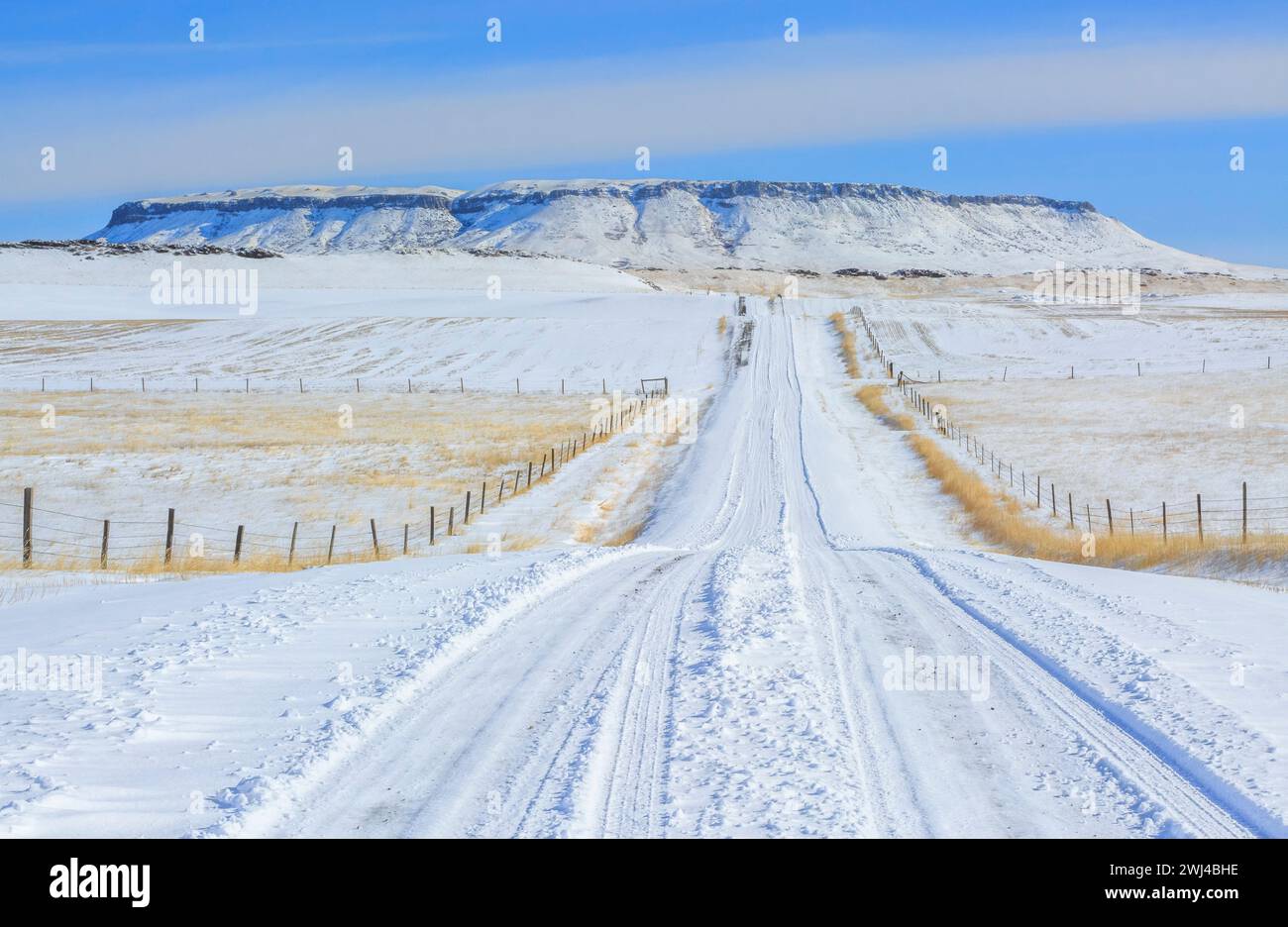 rolling backroad heading to square butte in winter near cascade ...