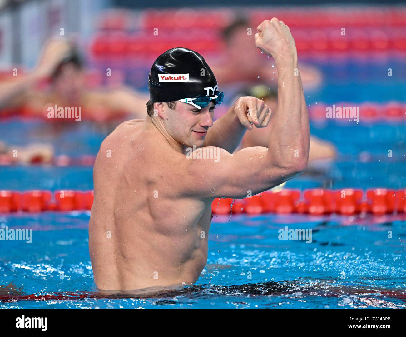 Doha, Qatar. 12th Feb, 2024. Nic Fink of the United States celebrates ...