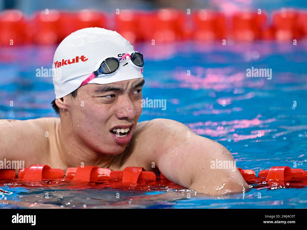 Doha, Qatar. 12th Feb, 2024. Ji Xinjie of China reacts after the men's ...