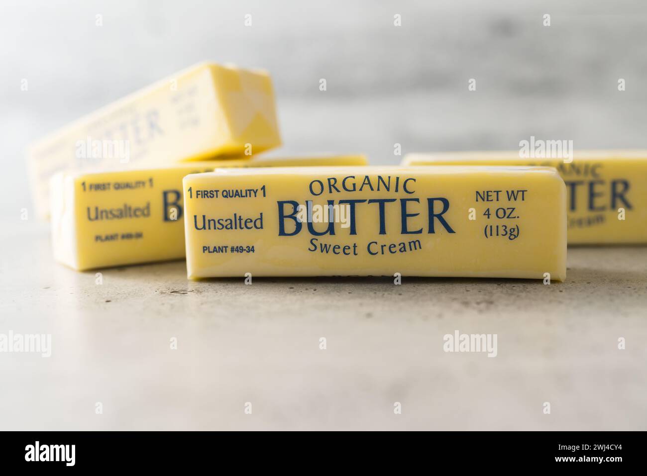 Butter sticks close-up. Wrapped organic unsalted butter sticks on a ...