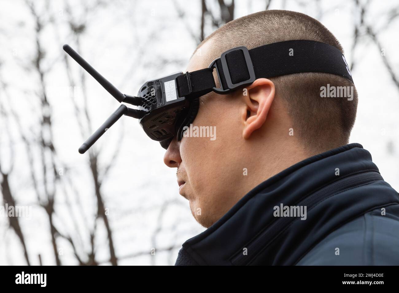 A young man is seen wearing virtual reality goggles during a FPV drone ...