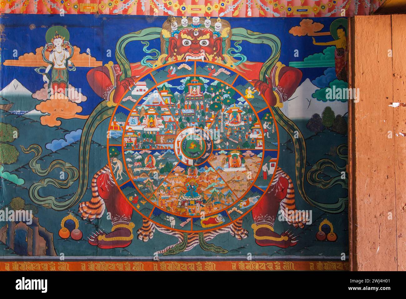 Yama, Lord of Death, holds the Buddhist Wheel of Life in the entrance ...