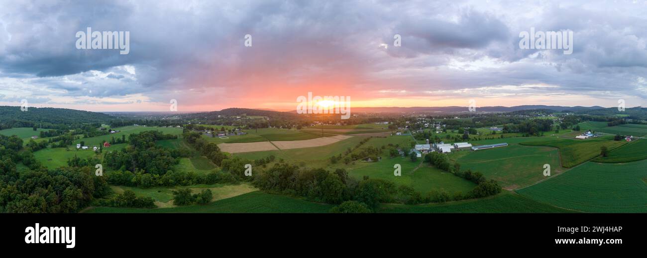 A beautiful panoramic aerial view of clouds and the sunset over the ...