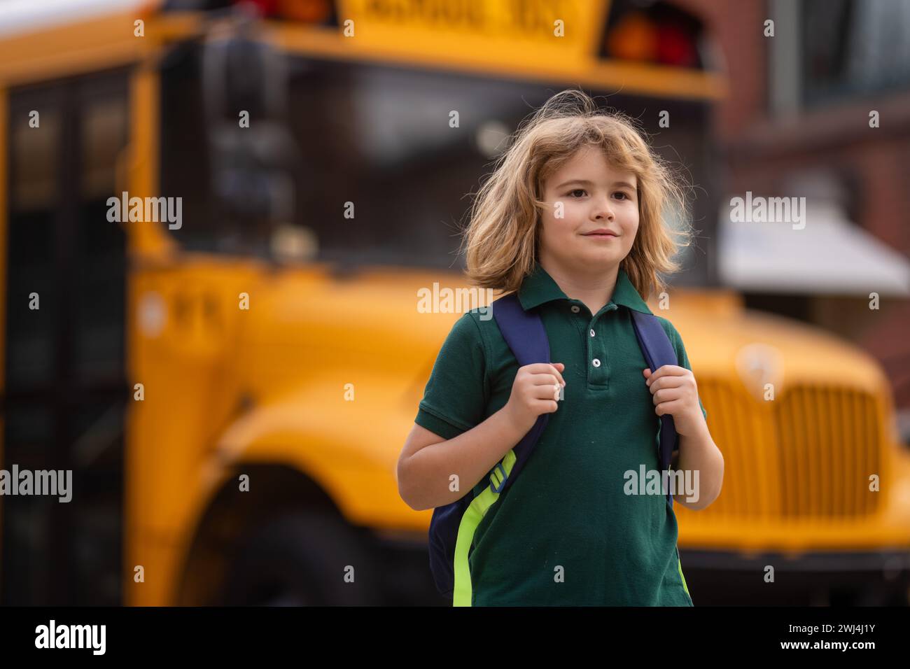 Schoolchild getting on the school bus. American School. Back to school ...